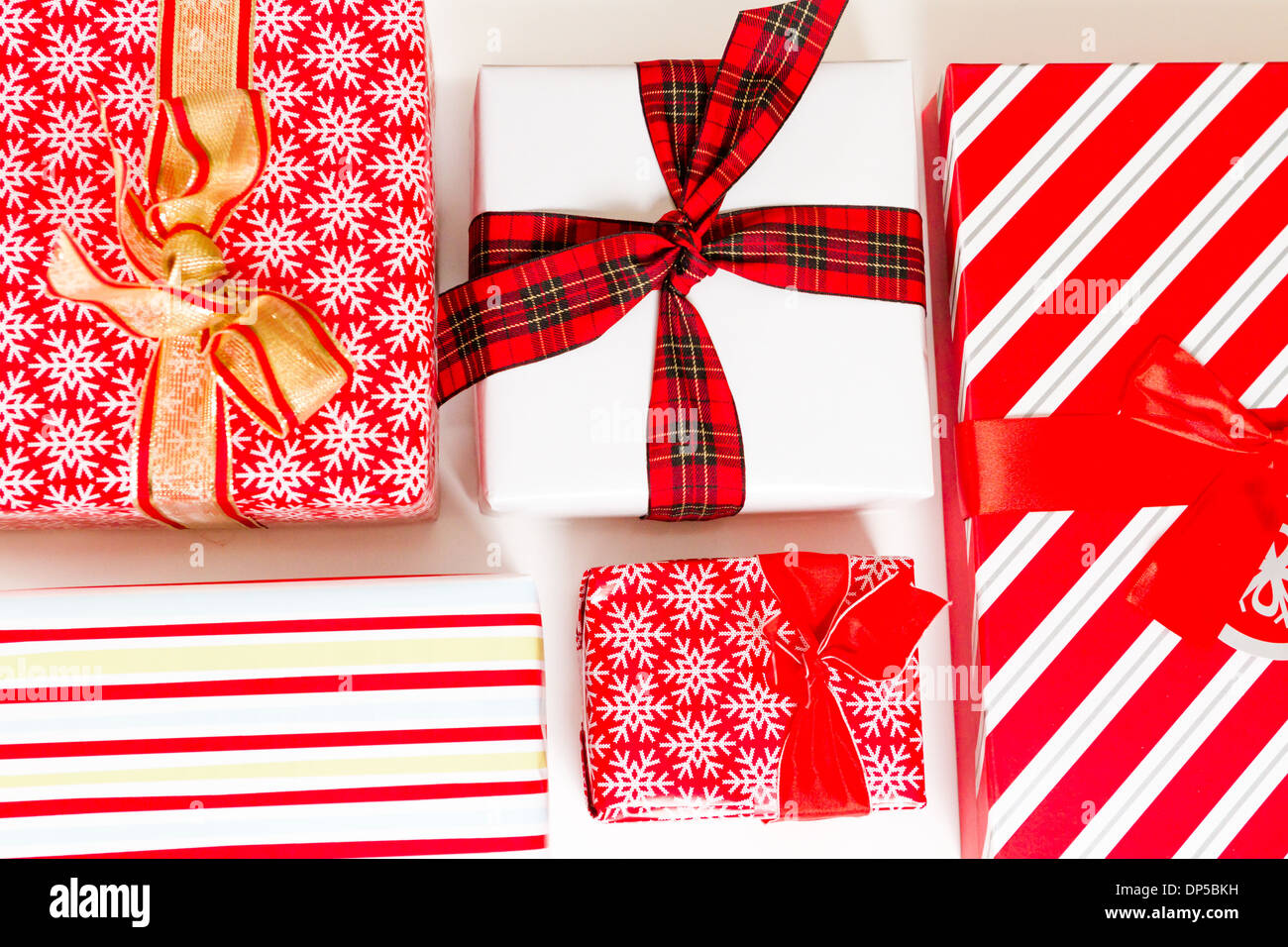 Christmas presents wrapped in colorful paper Stock Photo - Alamy