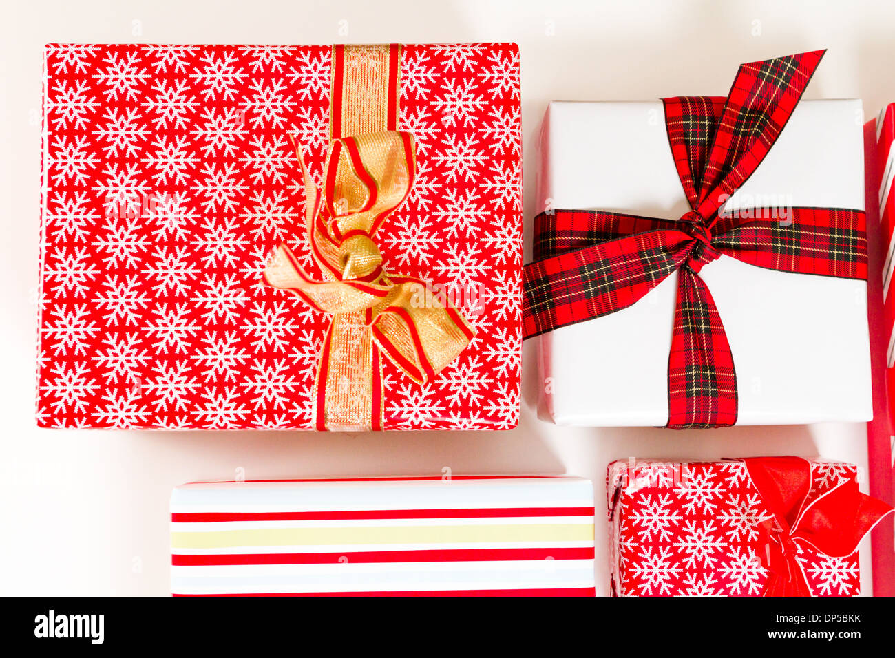 Christmas presents wrapped in colorful paper Stock Photo - Alamy