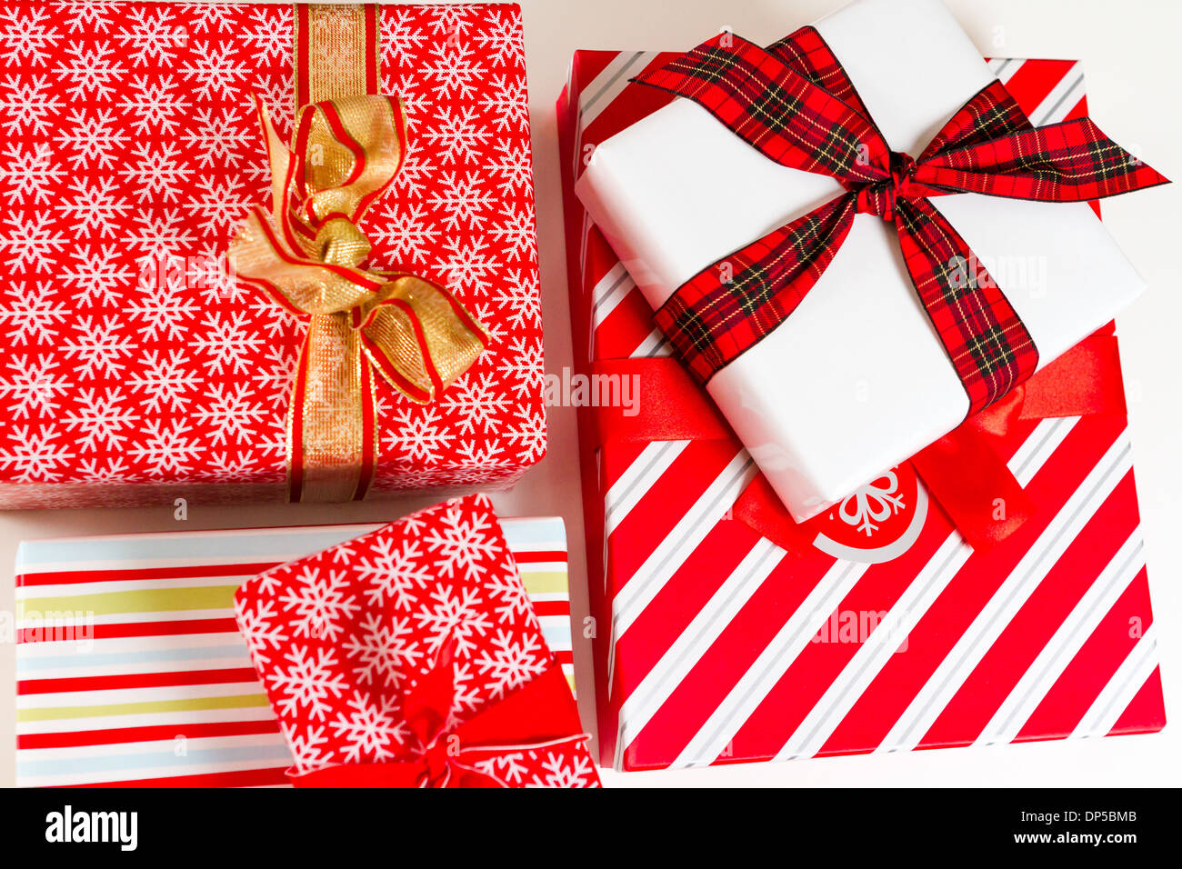 Christmas presents wrapped in colorful paper Stock Photo - Alamy