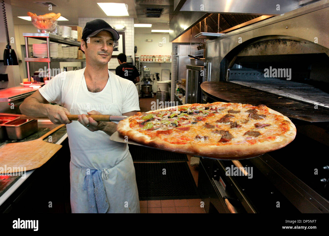 Sep 20, 2006; Oceanside, CA, USA; Owner/chef JOE CAPOZZOLI removes a ...
