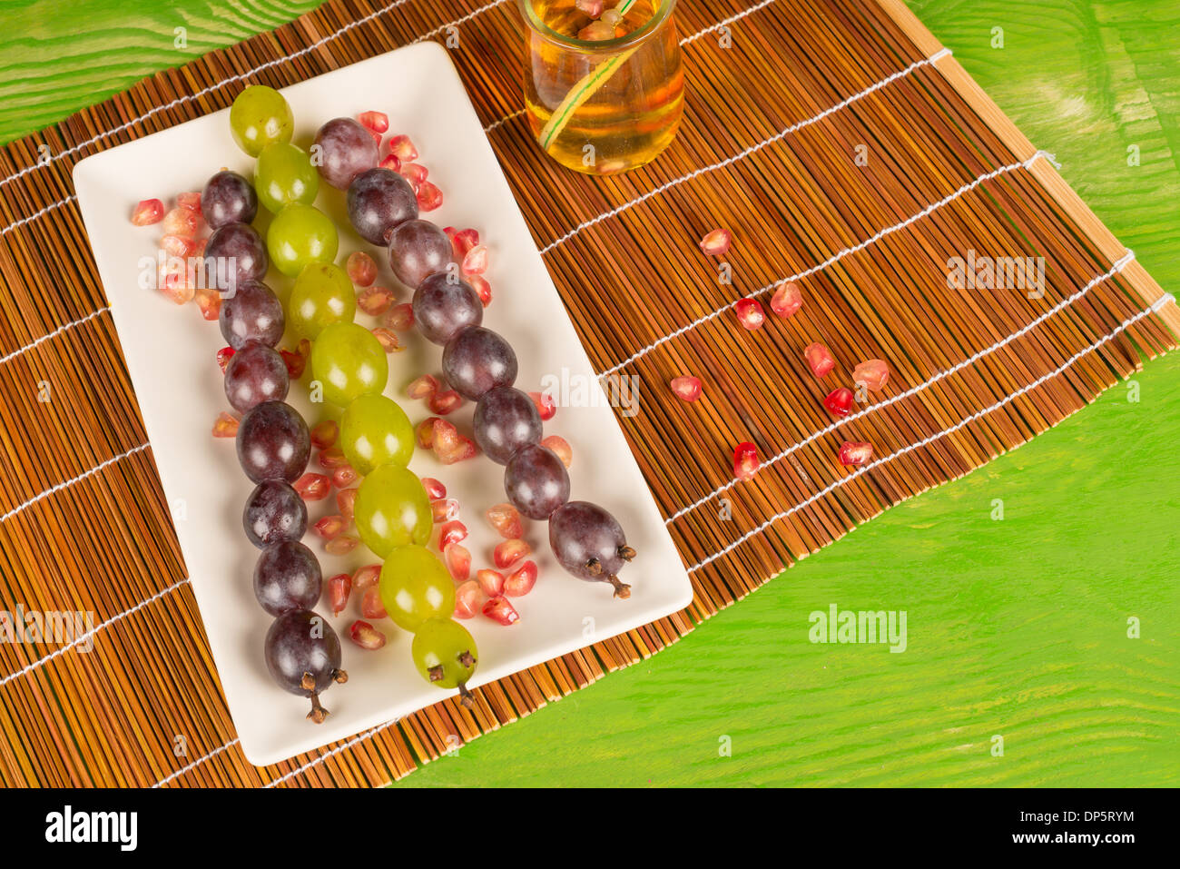 Grapes served as snakes, a kid dessert idea Stock Photo - Alamy