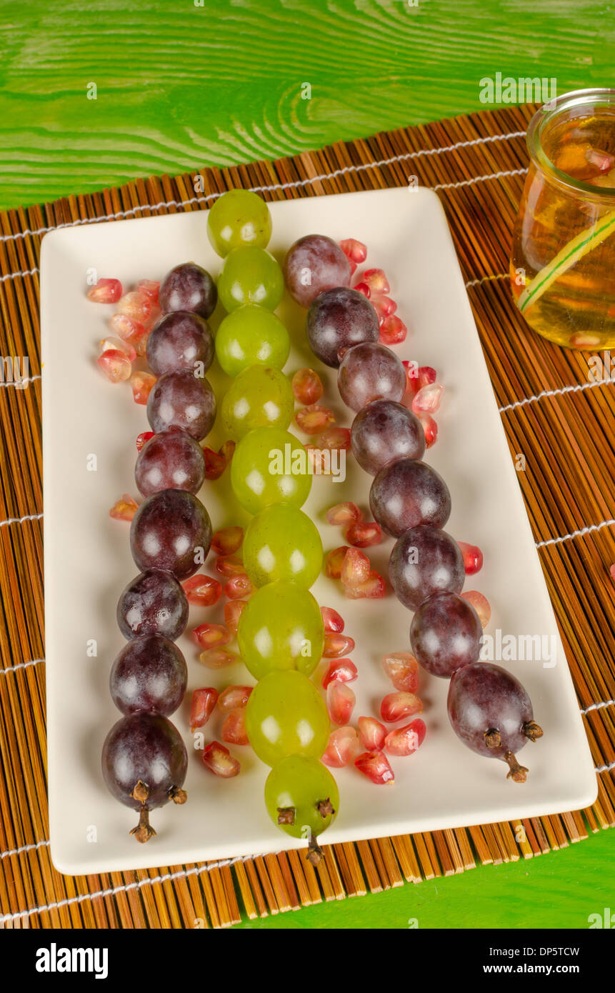 Grape snakes, an idea for a kid dessert Stock Photo - Alamy