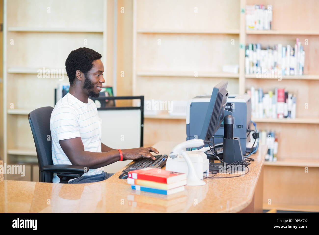 Young male librarian on hi-res stock photography and images - Alamy