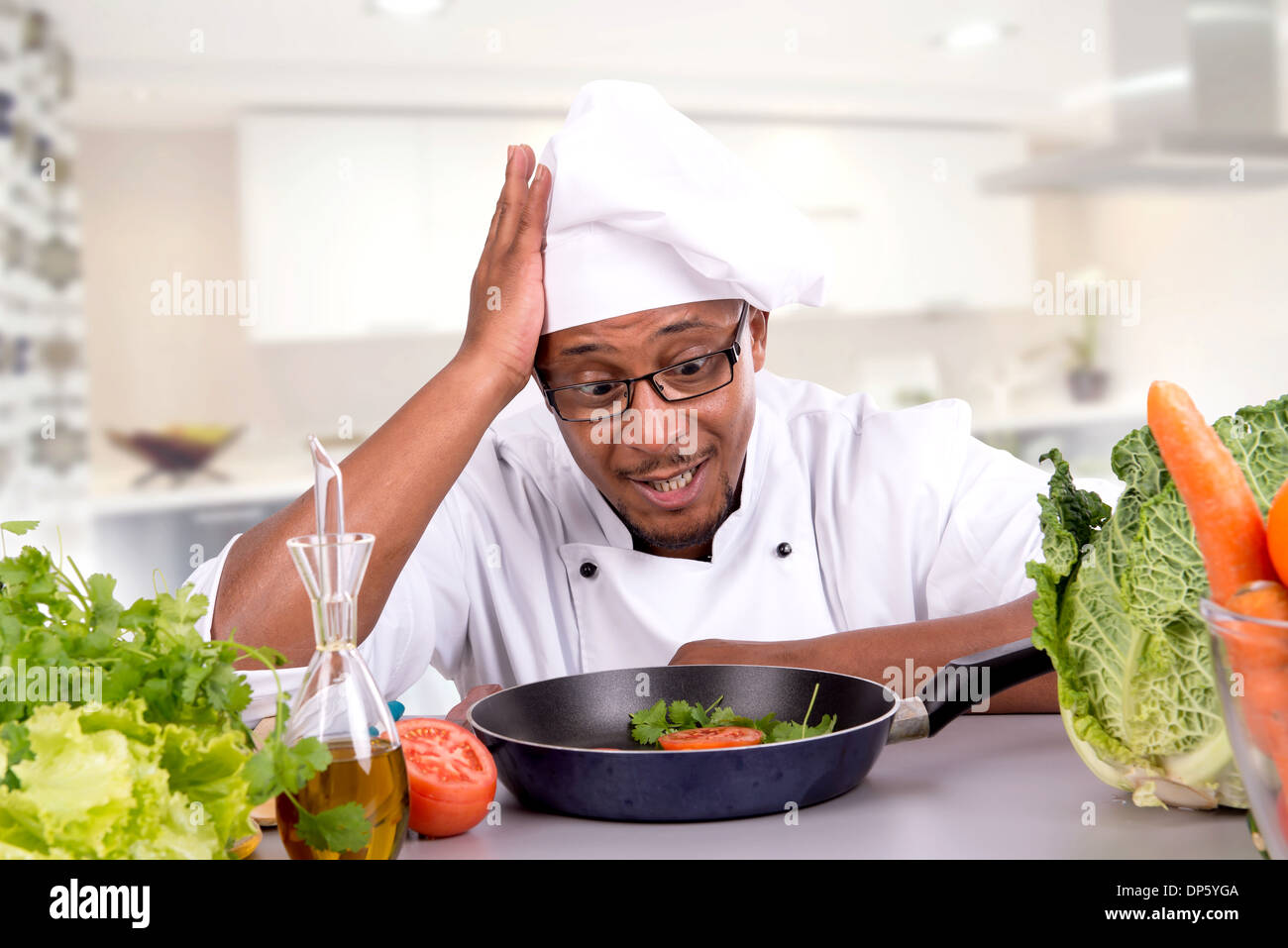 Desperate male chef with fruits and vegetables cooking Stock Photo - Alamy