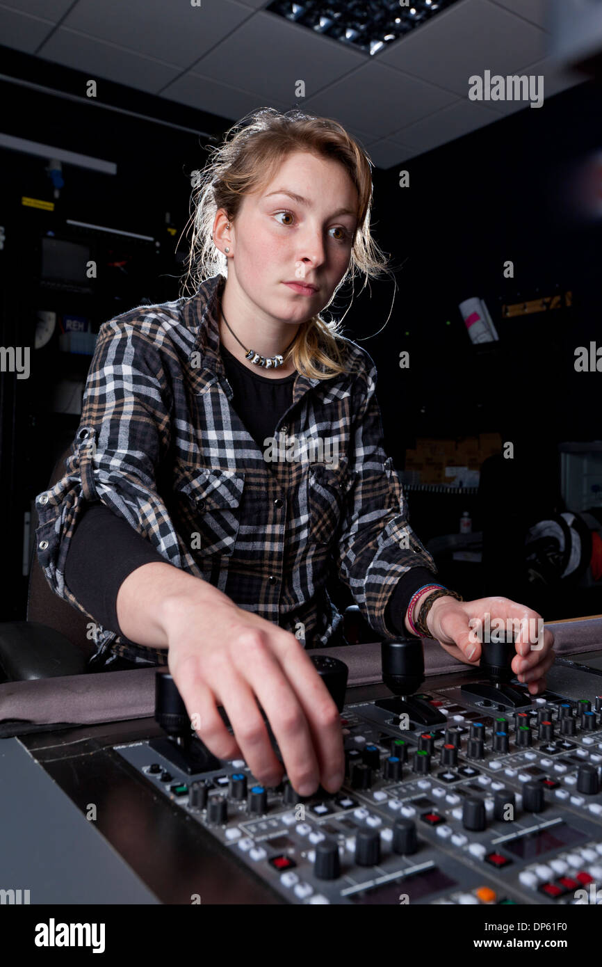 Television crew member adjusting exposure and colour balance of ...