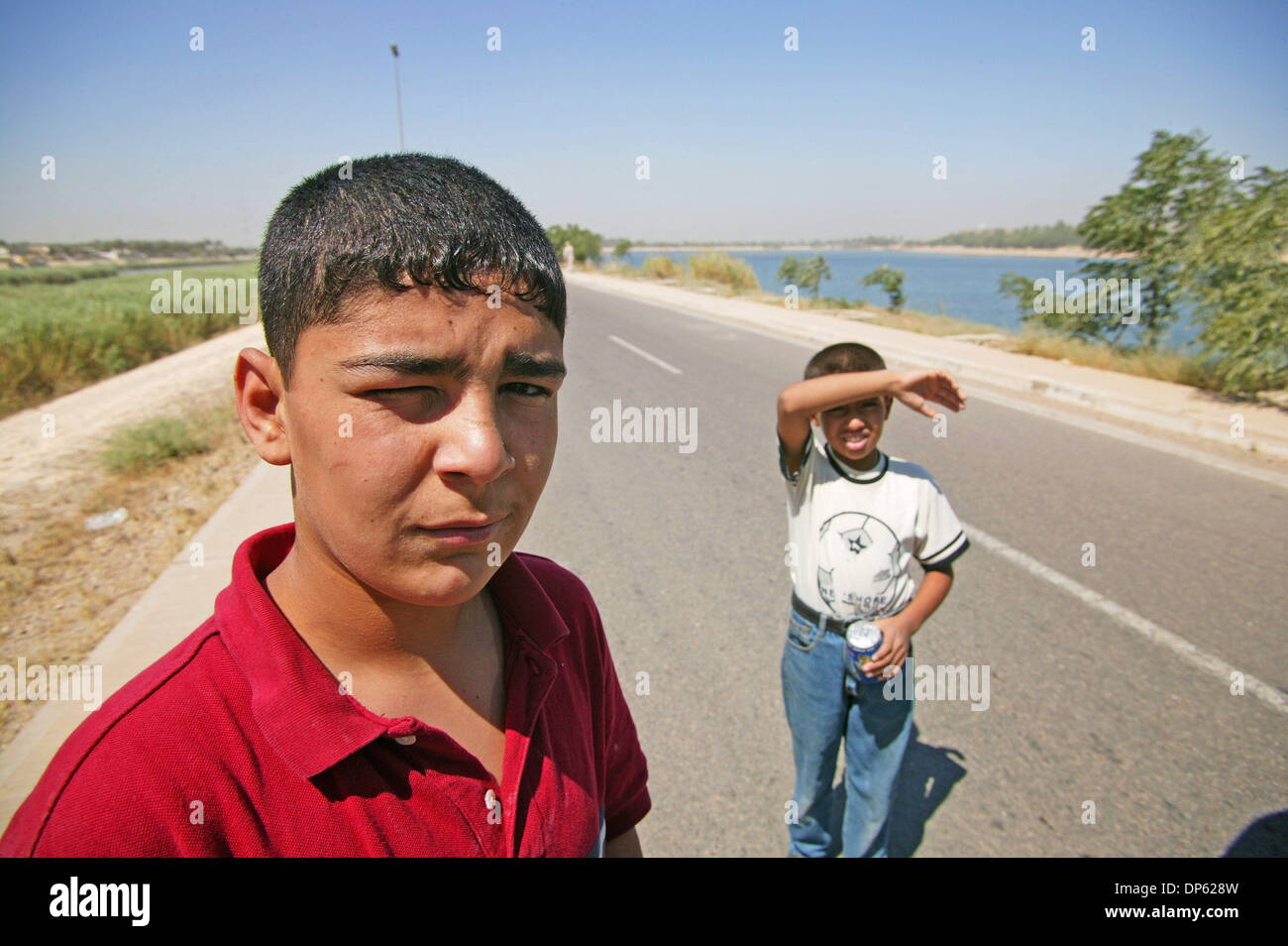 Jun 06, 2006; Baghdad, IRAQ; Iraqi boys walk along the Tigris River ...