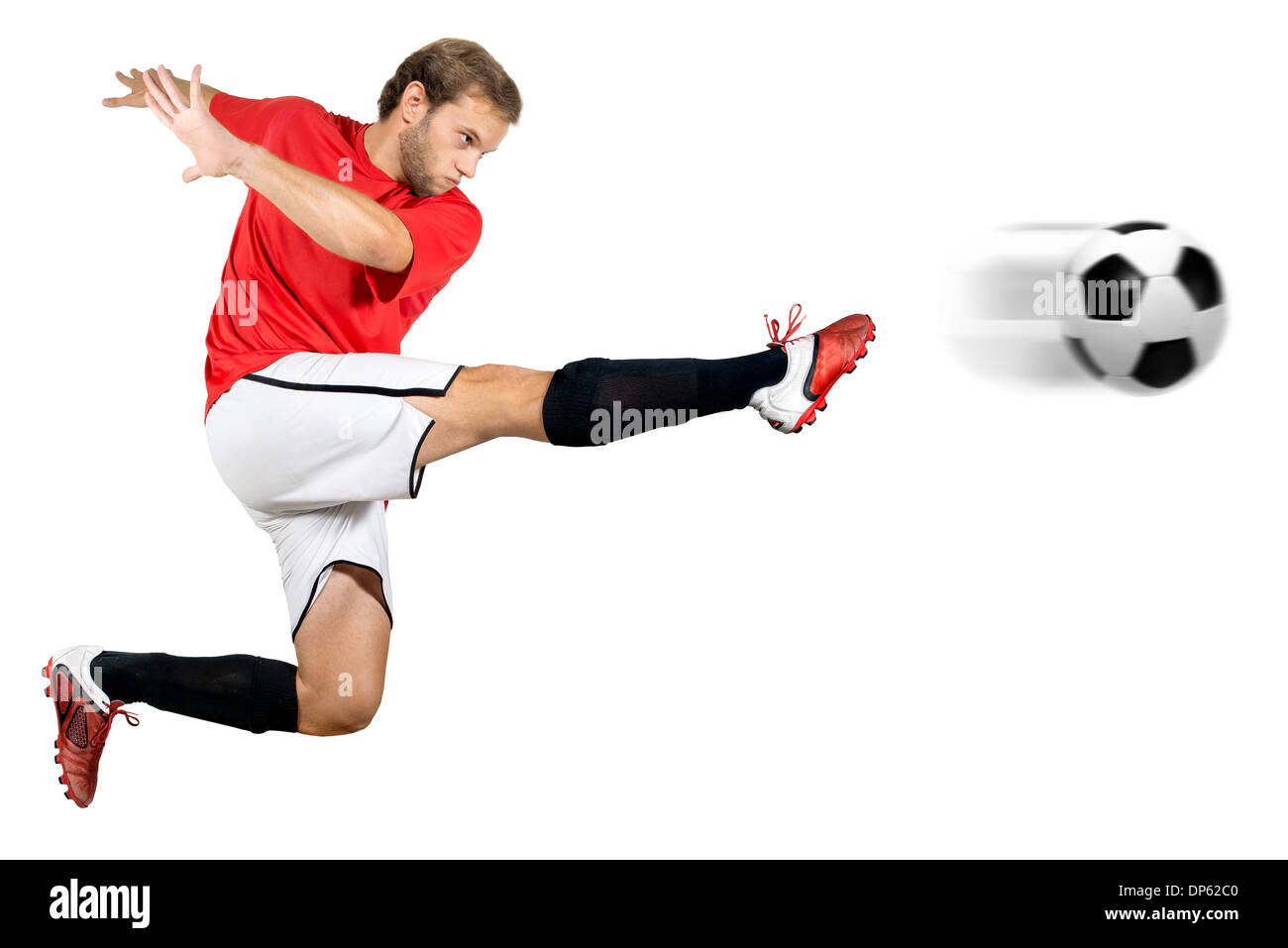 Football player kicking a ball isolated in white Stock Photo - Alamy