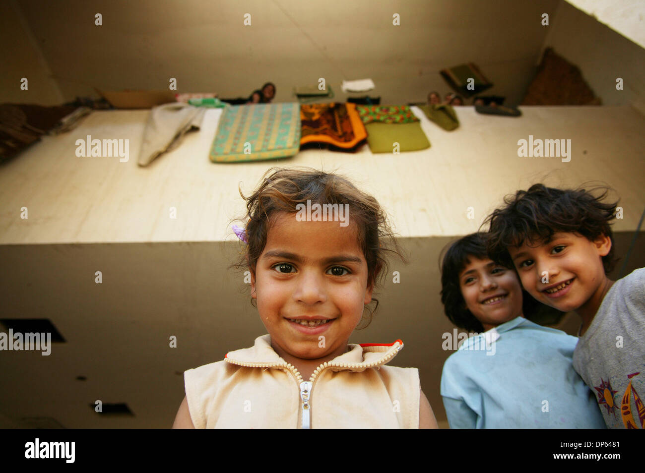 Oct 06, 2006; Baghdad, IRAQ; Iraqi children play below a balcony in the ...