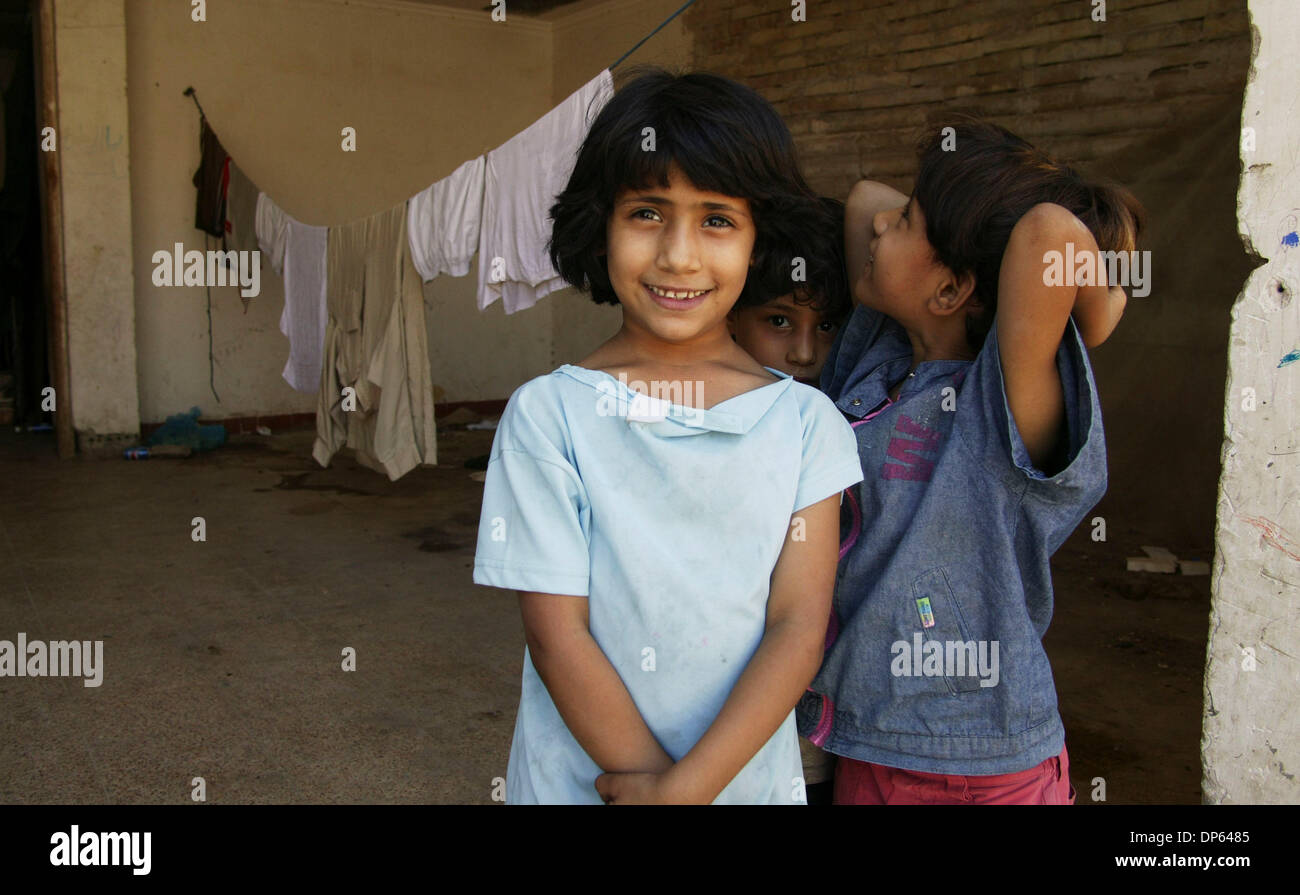 Oct 06, 2006; Baghdad, IRAQ; Iraqi children dry clothing on makeshift ...