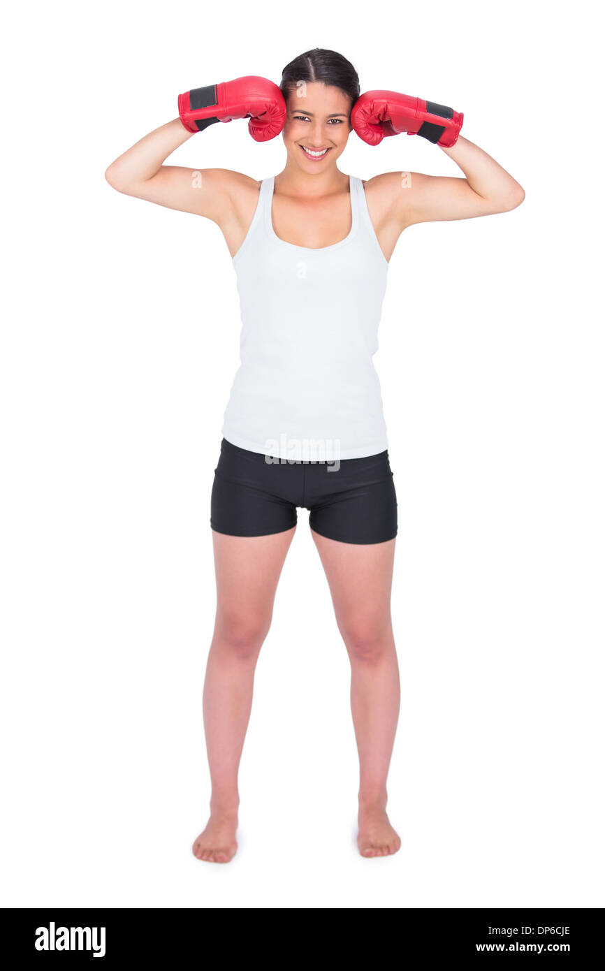 Happy young model with boxing gloves posing Stock Photo - Alamy