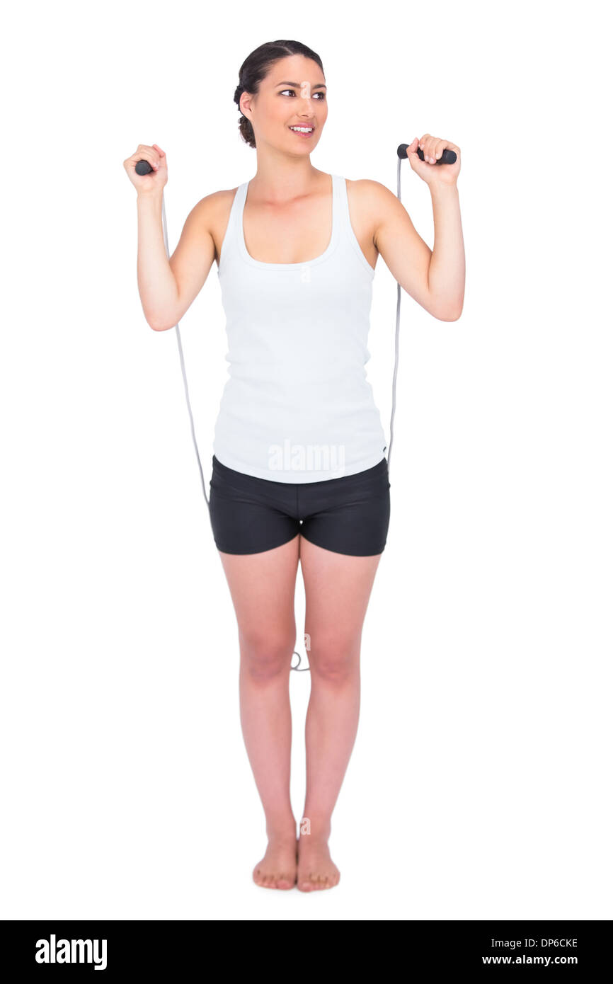 Cheerful slender model jumping rope Stock Photo - Alamy
