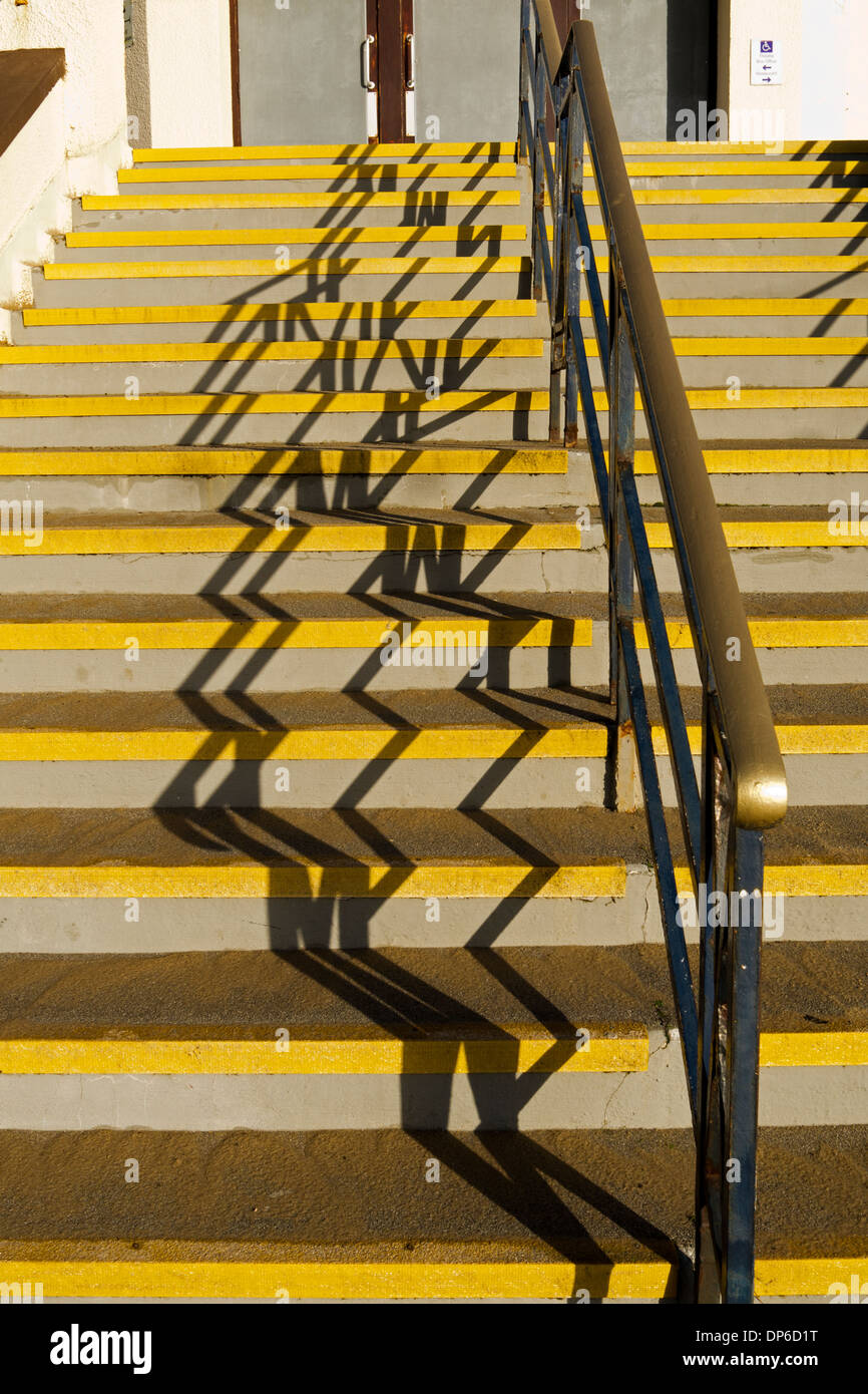 Shadow on steps cast by banisters Stock Photo - Alamy