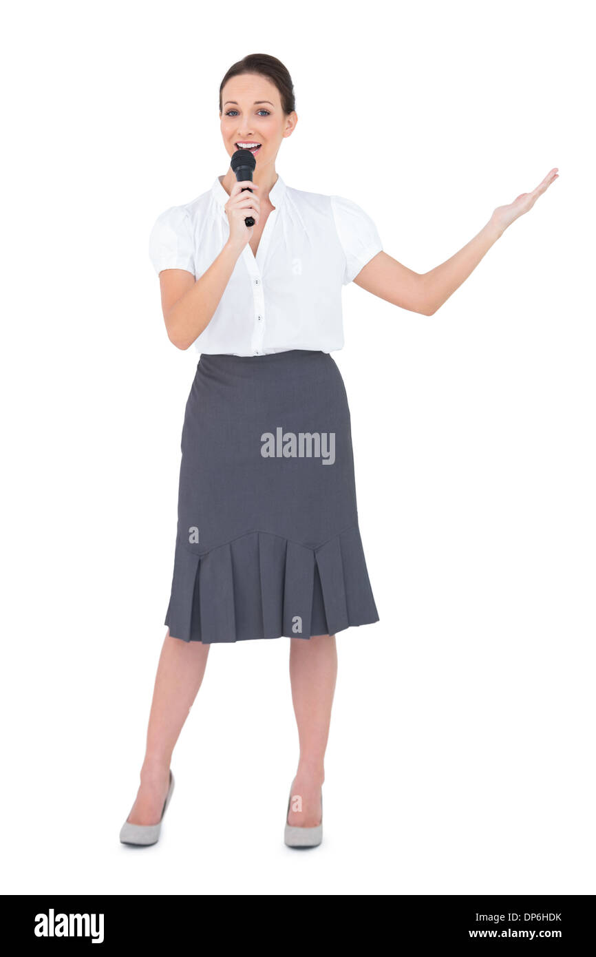Energetic presenter holding microphone Stock Photo - Alamy