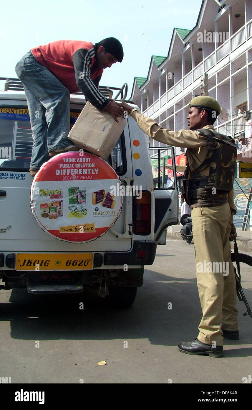 Oct 18, 2006; Srinagar, Kashmir, INDIA; Indian policemen frisk Kashmiri ...