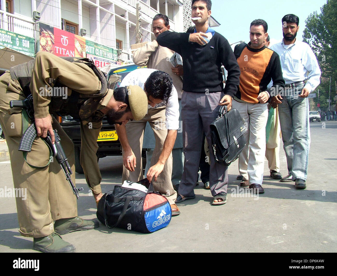 Oct 18, 2006; Srinagar, Kashmir, INDIA; Indian policemen frisk Kashmiri ...
