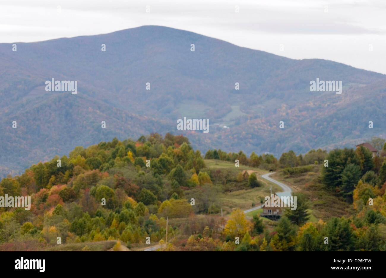 Oct 19, 2006; Boone, NC, USA; A home along a ridge with Roan Mountain ...