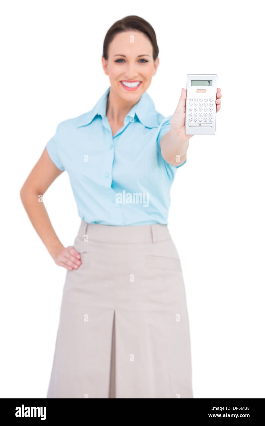 Smiling classy businesswoman showing calculator Stock Photo - Alamy