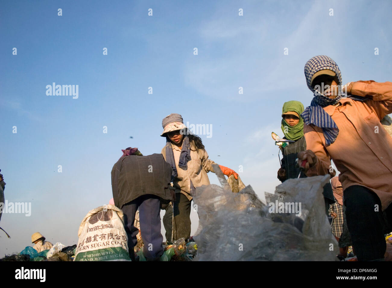 Workers look for recyclable material at the toxic Stung Meanchey ...