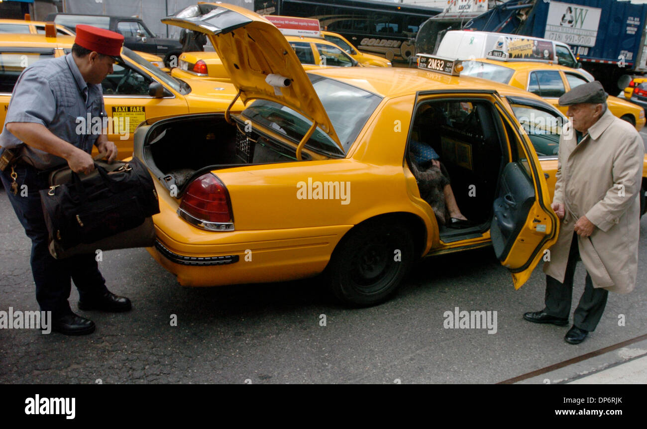 Oct 25, 2006; MANHATTAN, NEW YORK, USA; An elderly couple is assisted ...