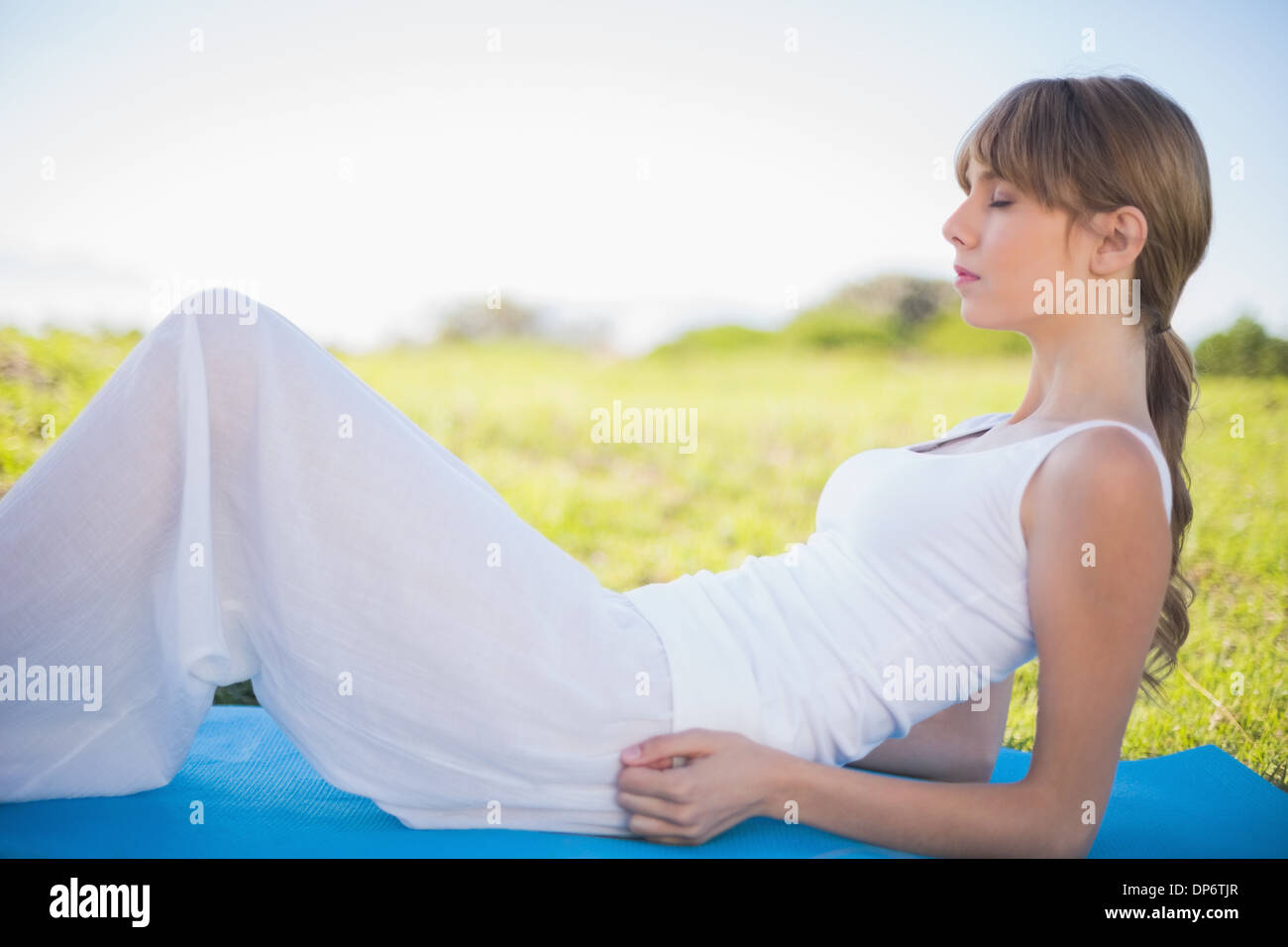 Beautiful woman relaxing park meditation hi-res stock photography and ...