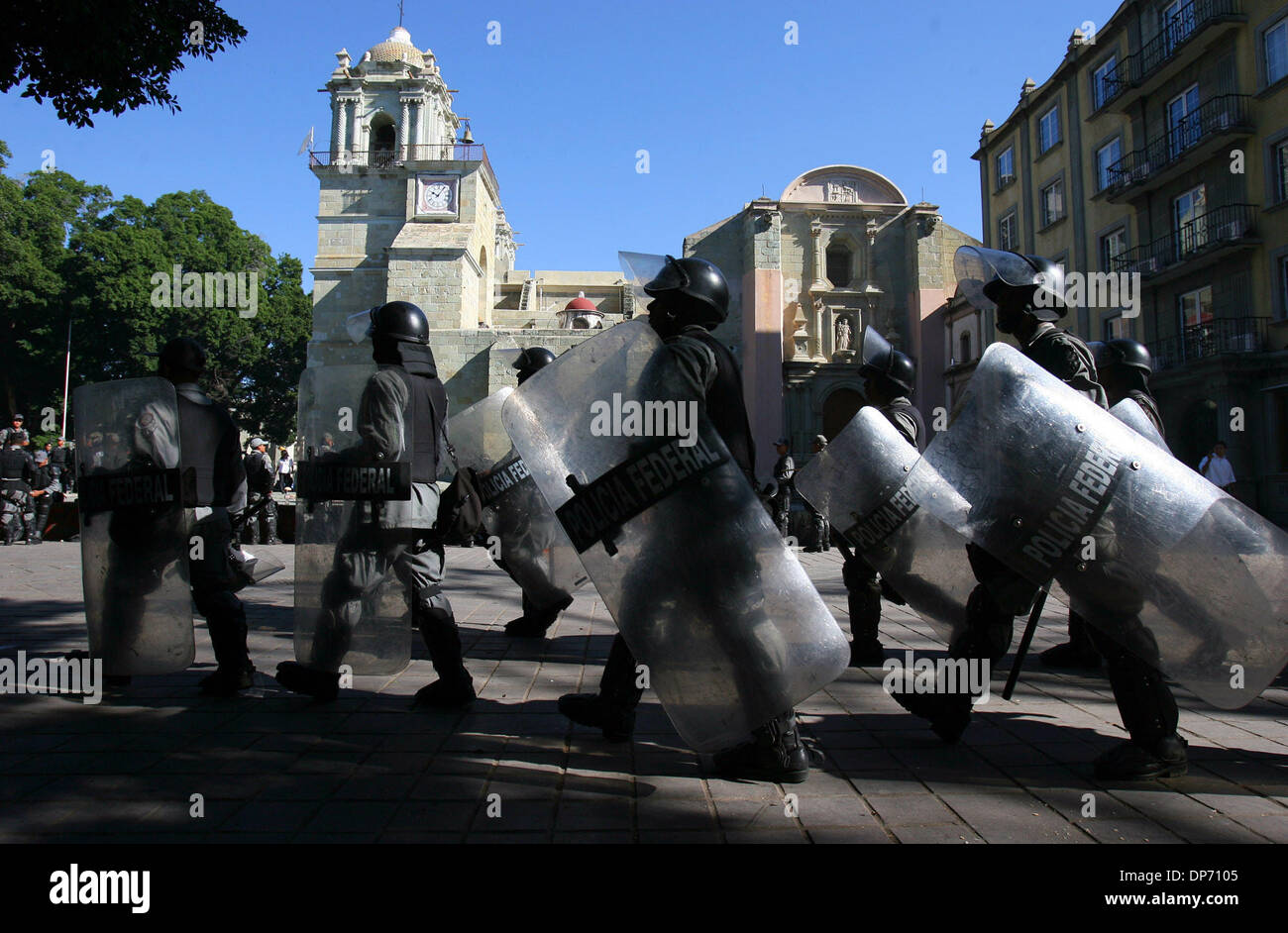 Oct 30, 2006; Oaxaca City, MEXICO; Federal police walk through the ...