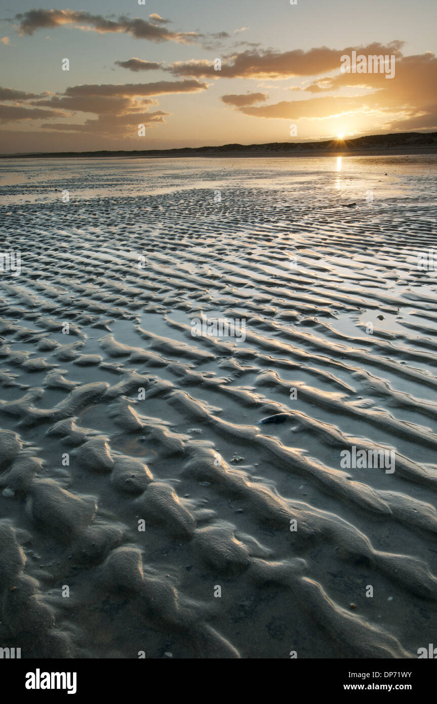 View of ripples in sand on beach during low tide at sunset, Camber ...