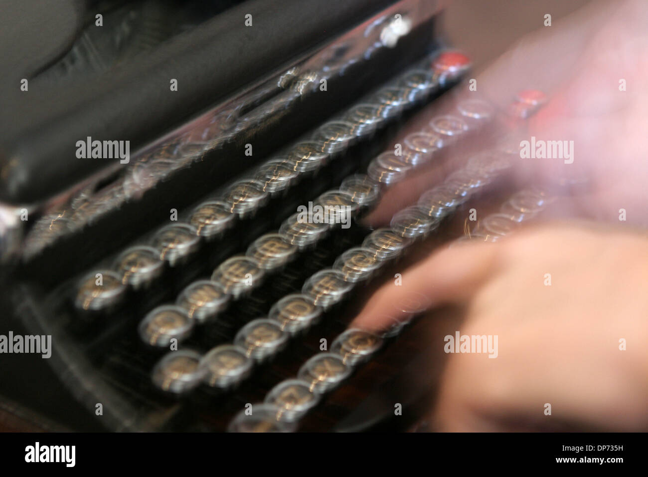 Oct 30, 2006; New York, NY, USA; A woman types on an old time type ...