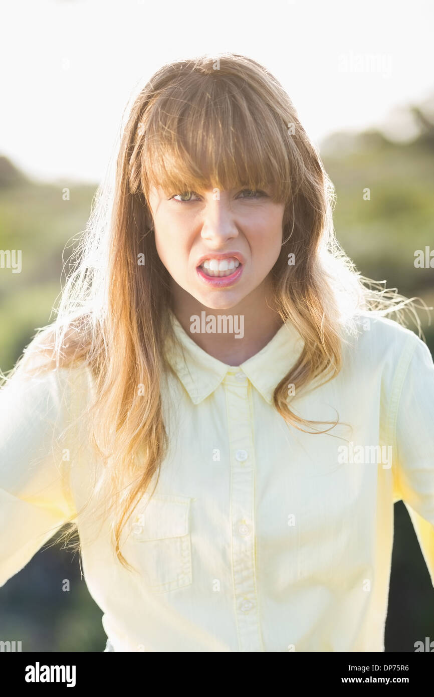 Angry gorgeous blonde posing on the roadside Stock Photo - Alamy