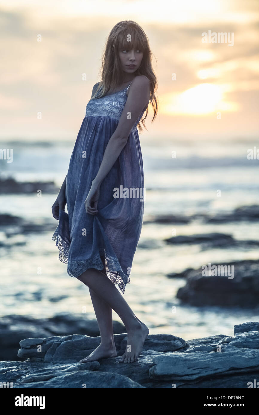 Female posing on rocks hi-res stock photography and images - Alamy