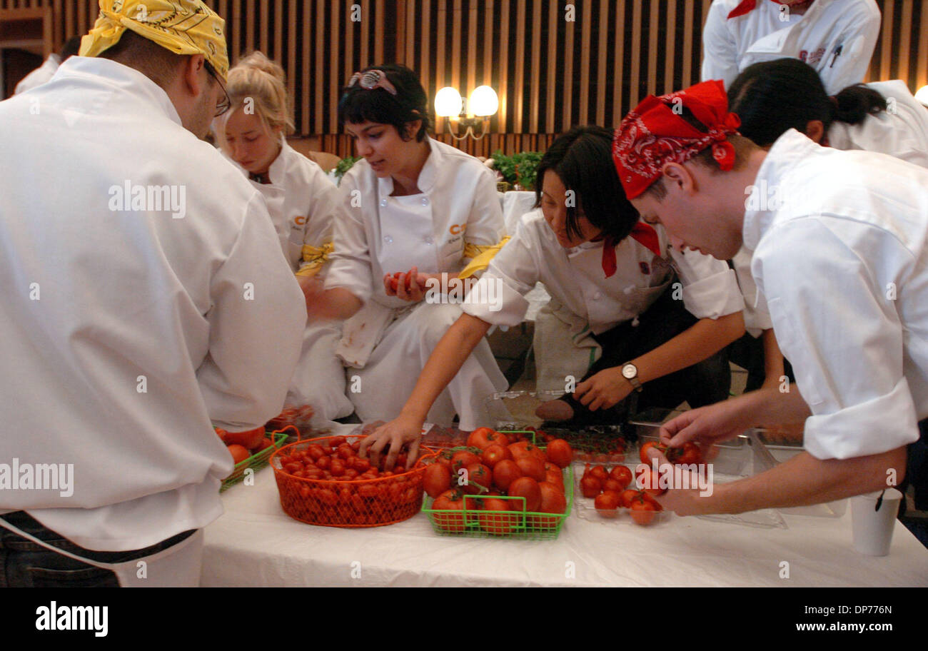 Nov 05, 2006; Berkeley, CA, USA; Chefs from both teams collect tomatos ...