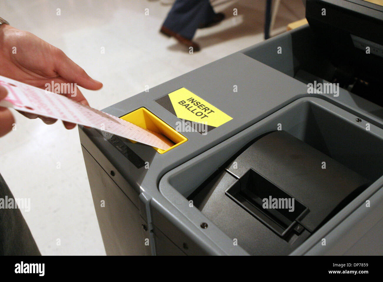 Nov 07, 2006; Los Angeles, CA, USA; A voter casts his ballot after work ...