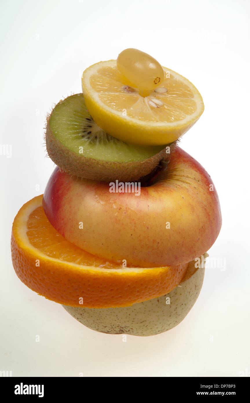 Different fruits that are cut into pieces and stacked like a sandwich ...