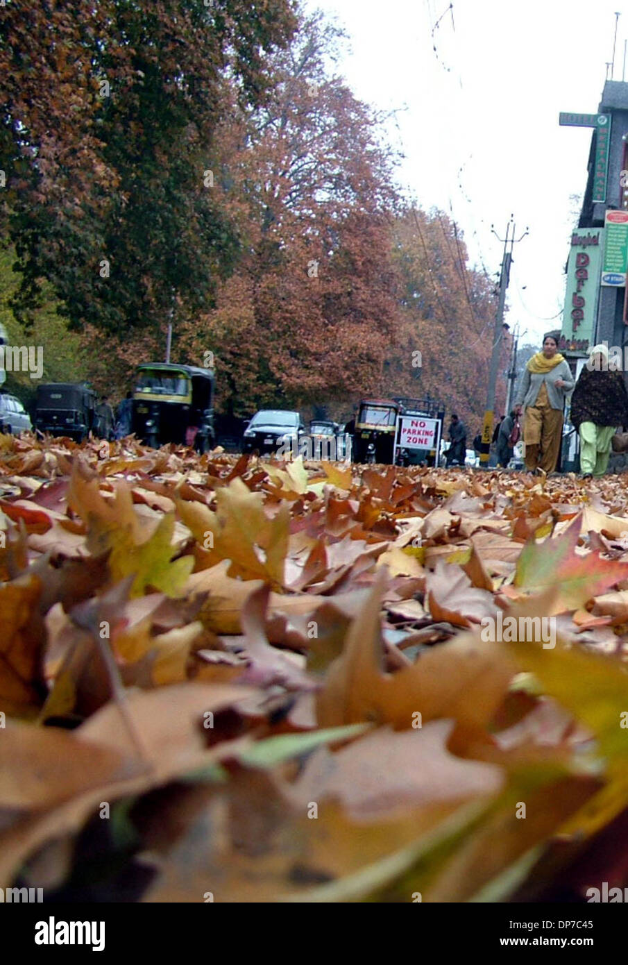 Nov 12, 2006; Srinagar, Kashmir, INDIA; Kashmiri citizens pass through ...