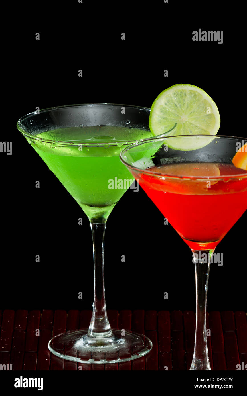 party cocktails green and red isolated on a black background Stock ...