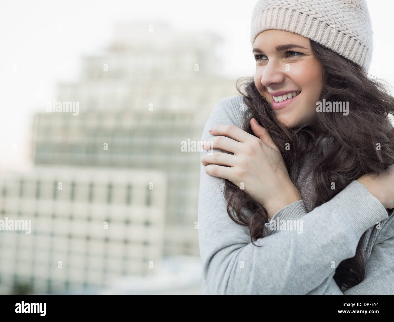 Cheerful young woman keeping hi-res stock photography and images - Alamy