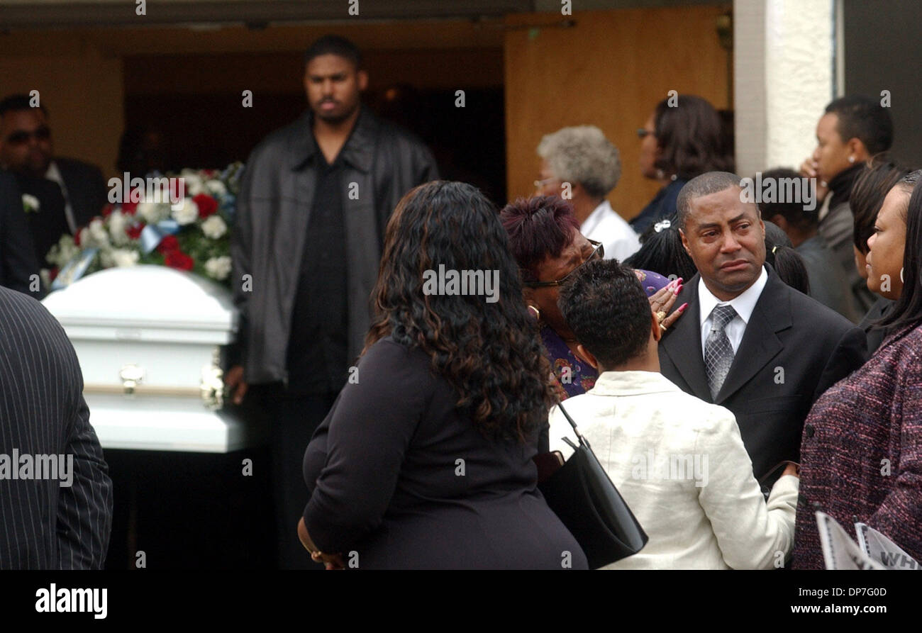 Raijon Daniels' body is carried out in a white casket at the end of an ...