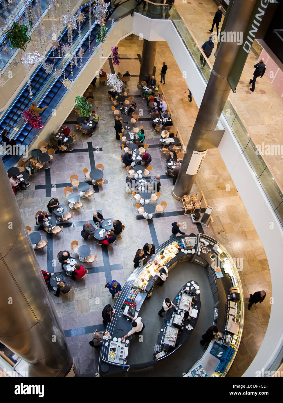 A busy food court and cafeteria within a shopping mall as seen from ...
