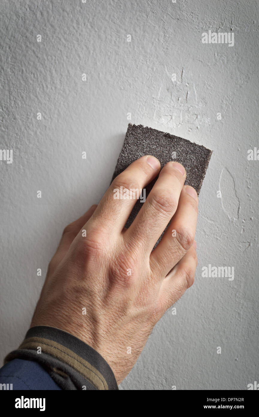 Handyman smoothing wall sandpaper tool hi-res stock photography and ...