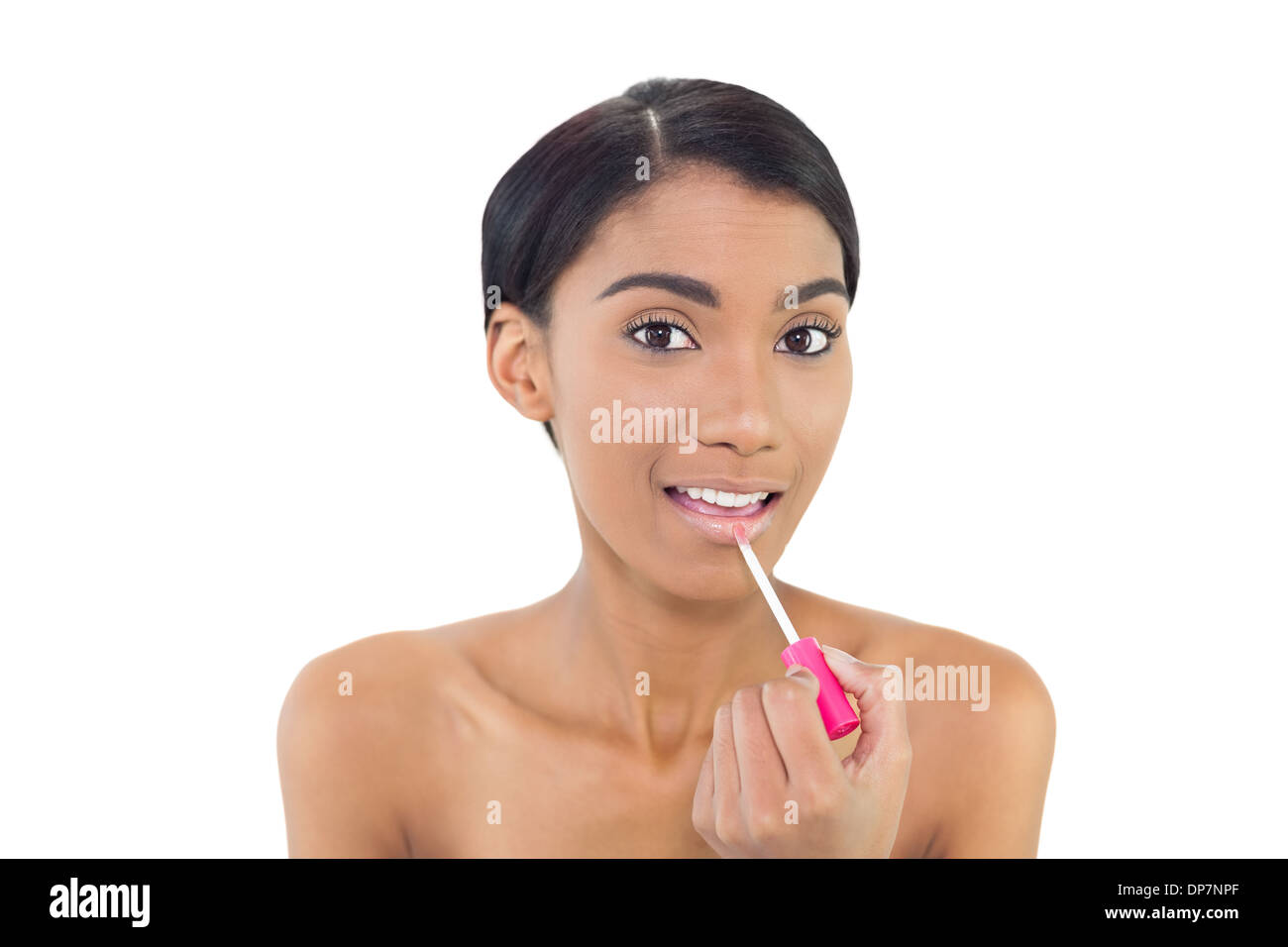 Pretty natural model applying glossy lipstick Stock Photo - Alamy