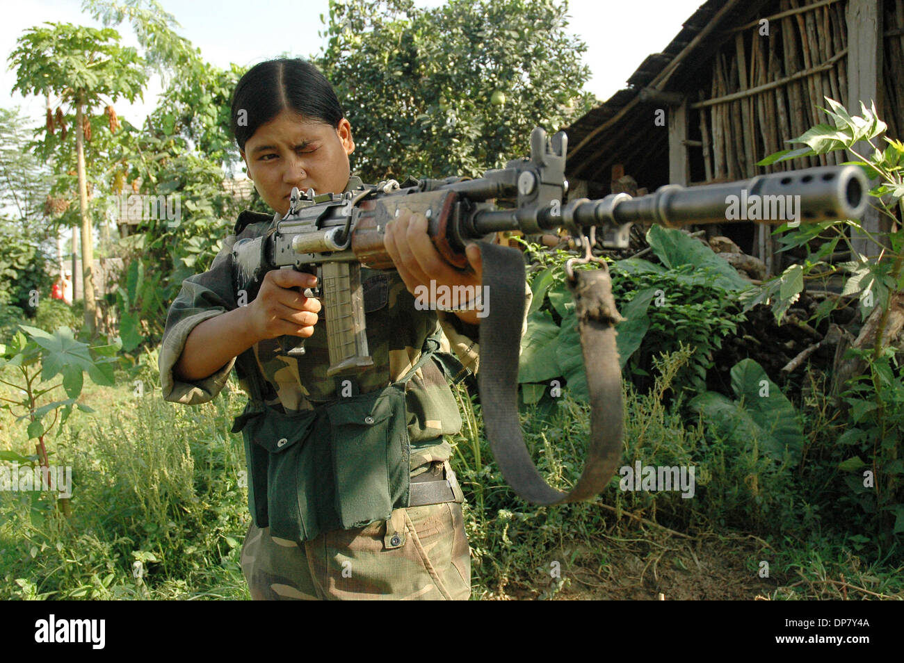 Nov 30, 2006; Sarlahi, NEPAL; 3rd Brigade PLA targeting gun while she ...