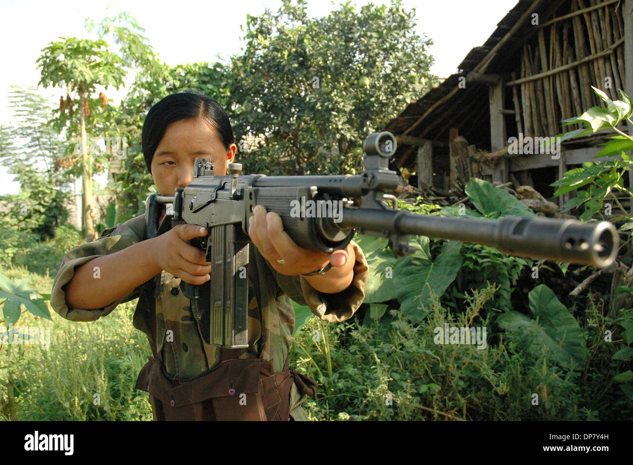 Nov 30, 2006; Sarlahi, NEPAL; 3rd Brigade PLA targeting gun while she ...