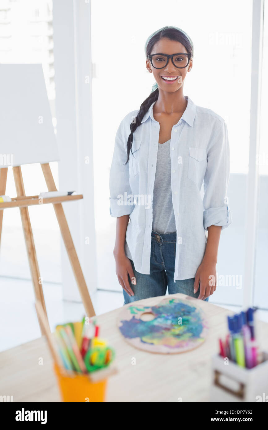 Smiling pretty artist posing Stock Photo - Alamy