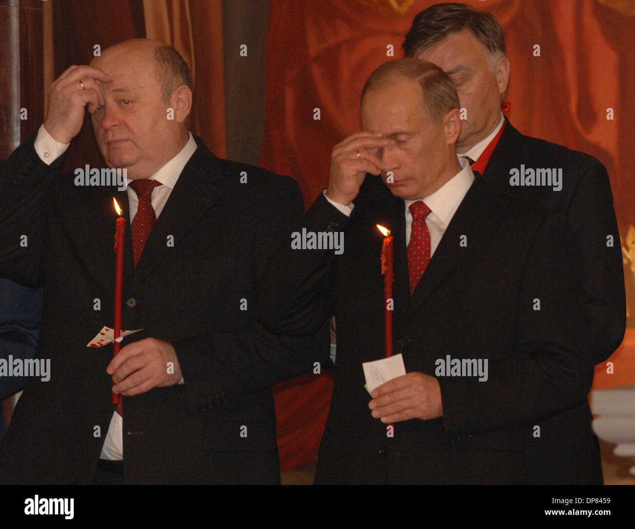 Mikhail Fradkov and Vladimir Putin praying in church. (Credit Image ...