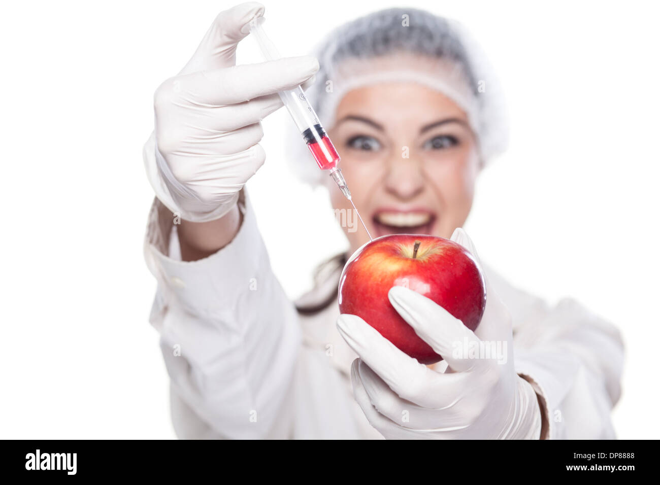 smiling malicious chemist woman injected some liquid in apple Stock ...