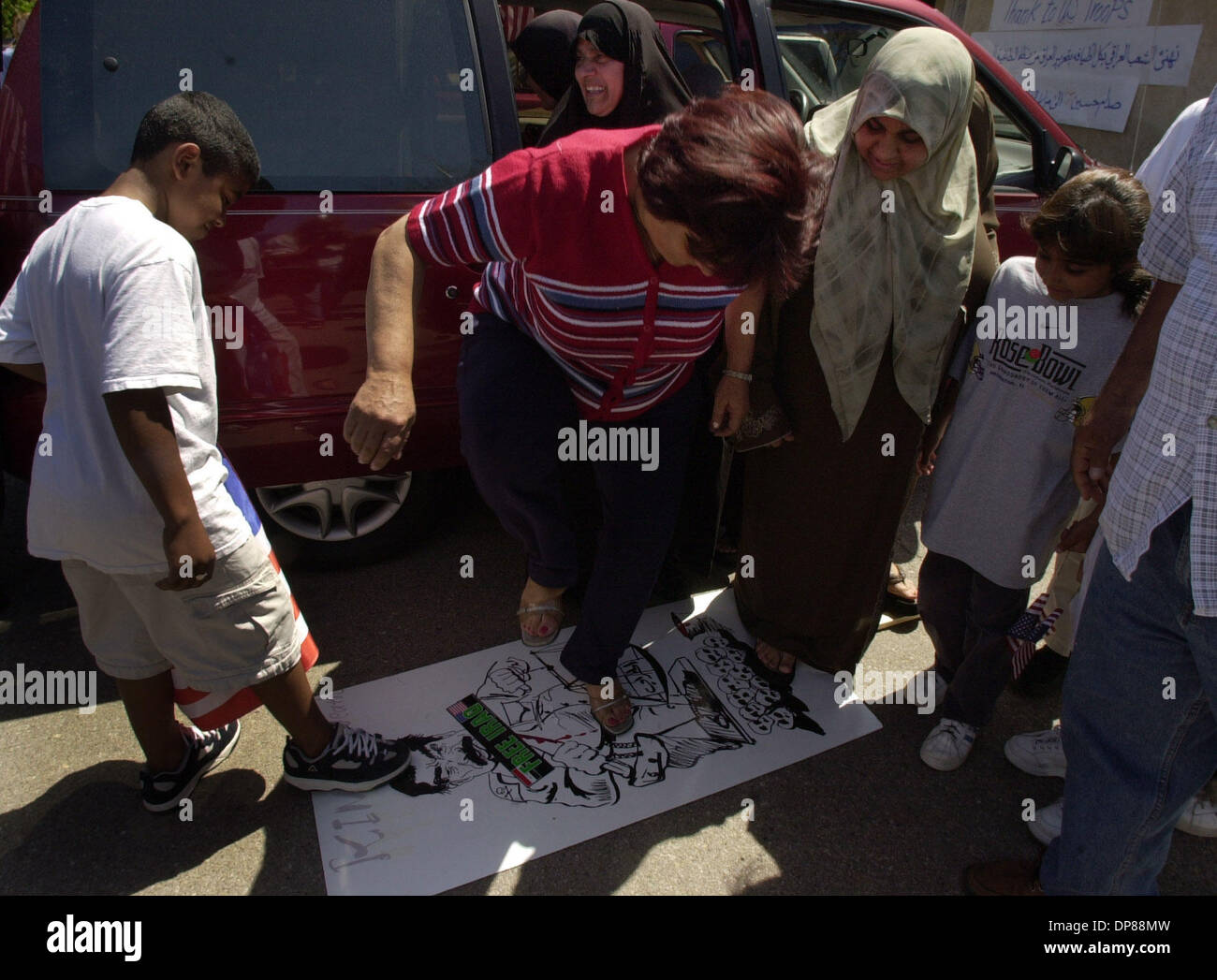 (PUBLISHED 04/10/2003, B-1:1,2,6,7): Sayran Kadir, left, with no scarf ...