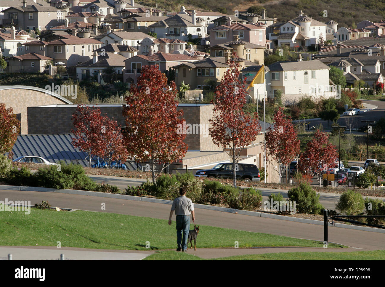 (Published 1/15/2006, N-3) A park goer with his dog leaves the dog run ...