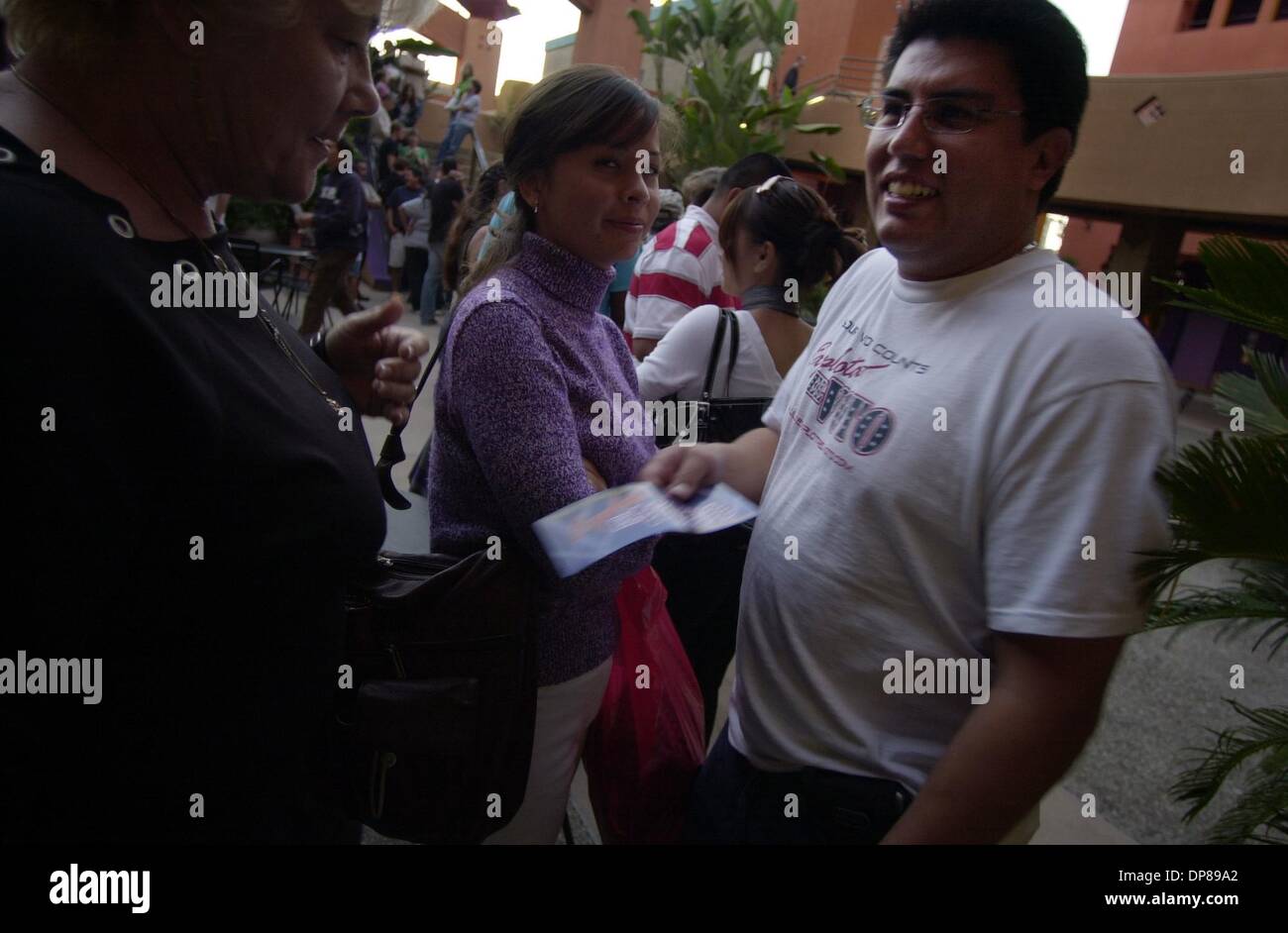 (Published 10/3/2004, A-16) Fred Sotelo, right, of Exclama El Voto ...