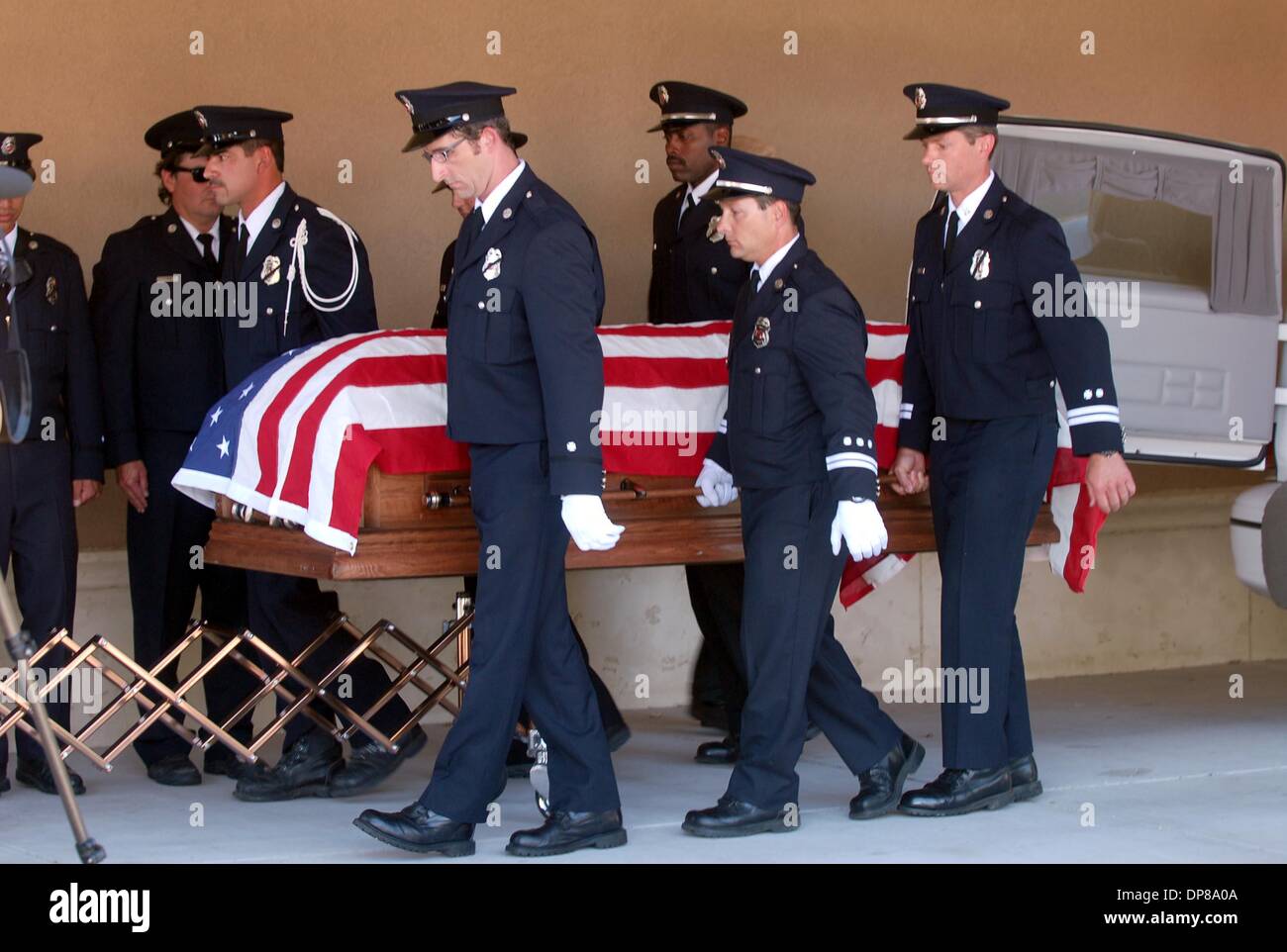 Firefighters carry the casket of Contra Costa County fire fighter ...