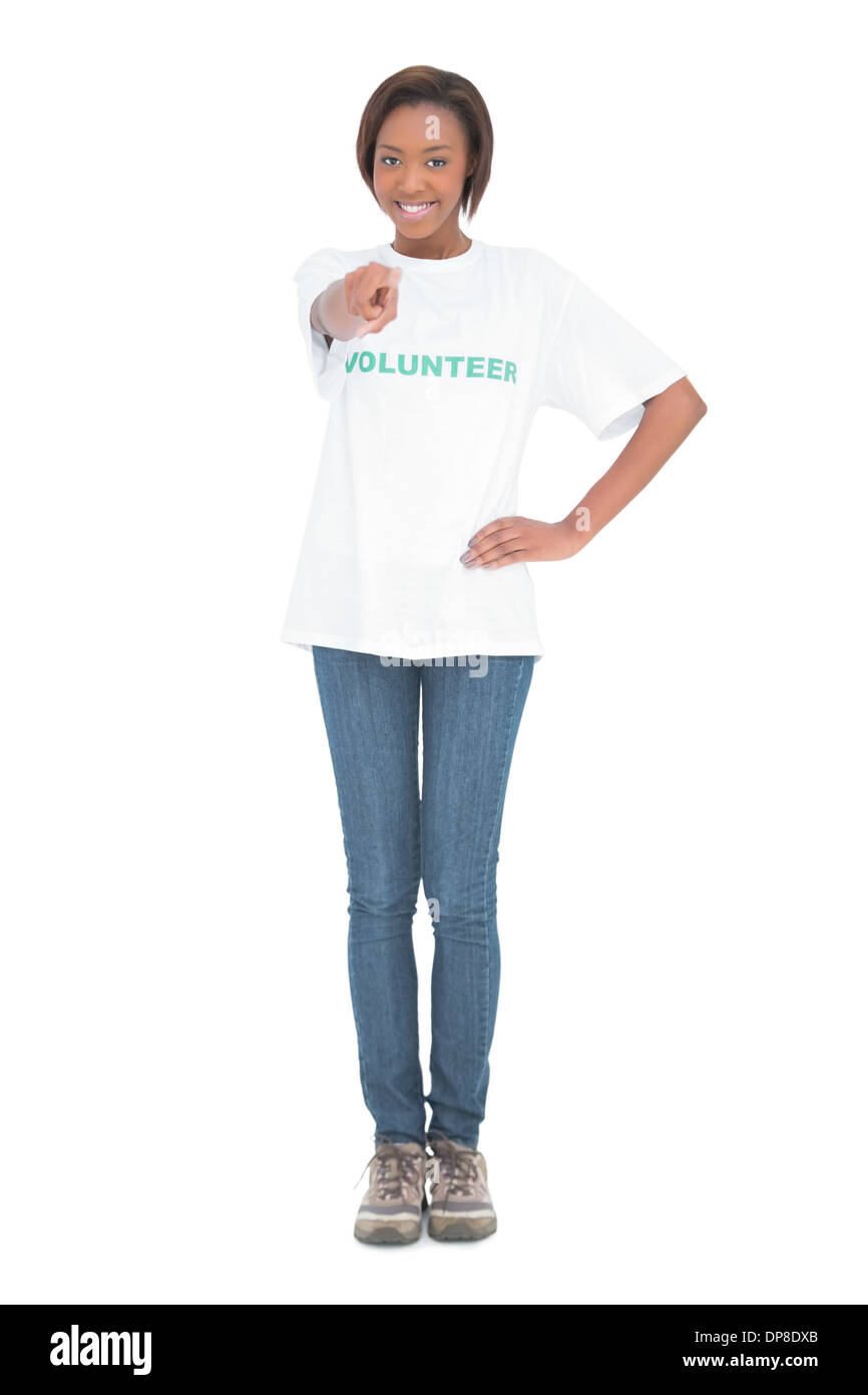 Smiling volunteer pointing straight Stock Photo - Alamy