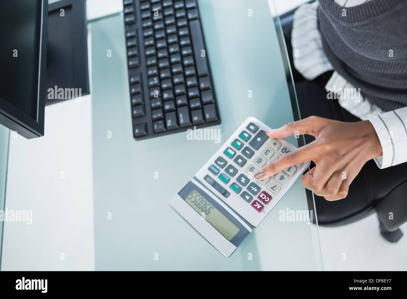 Office worker using calculator hi-res stock photography and images - Alamy